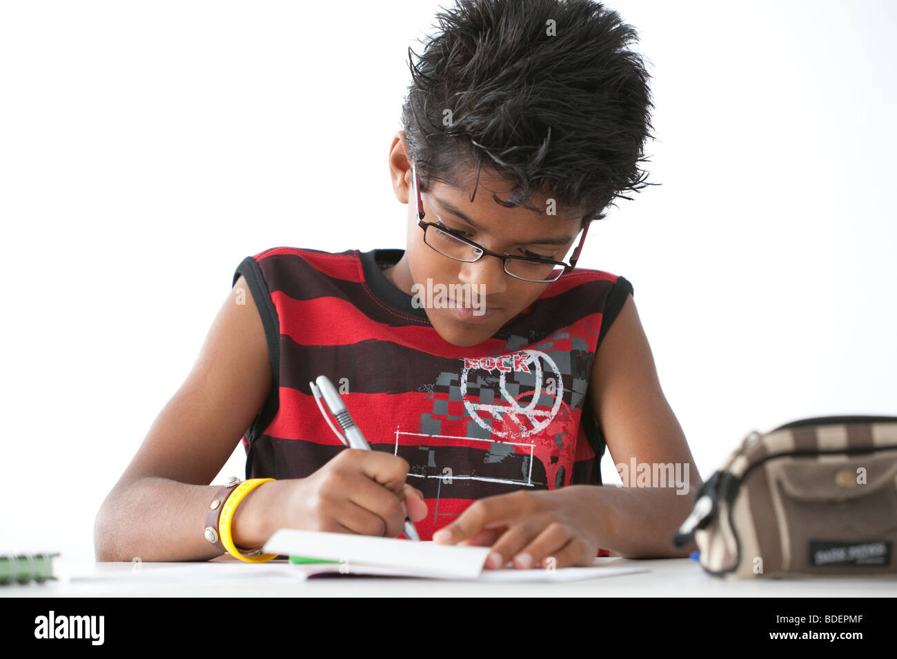 Teenage boy is making homework Stock Photo - Alamy