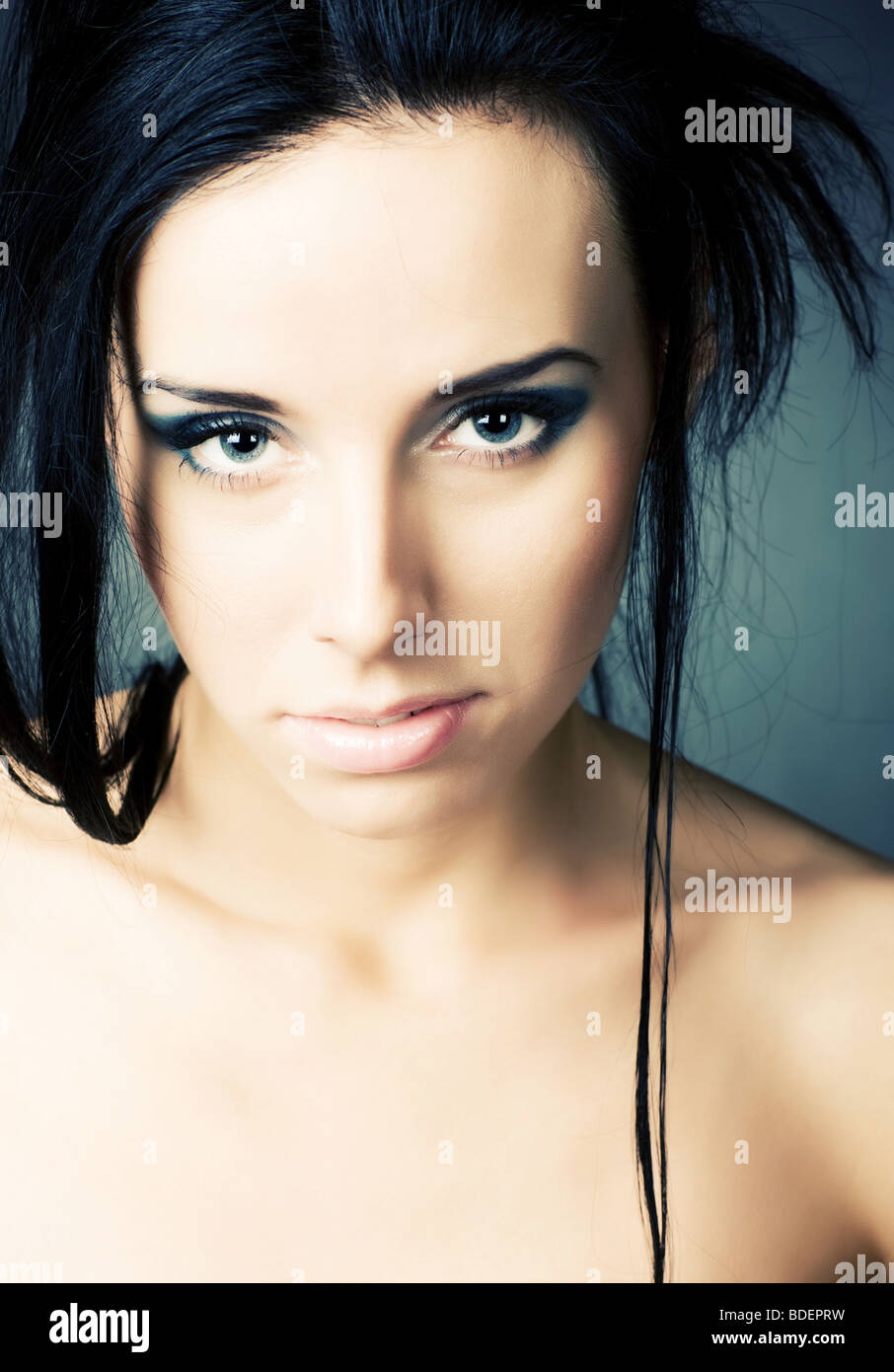 Young brunette woman soft portrait. On dark background Stock Photo - Alamy