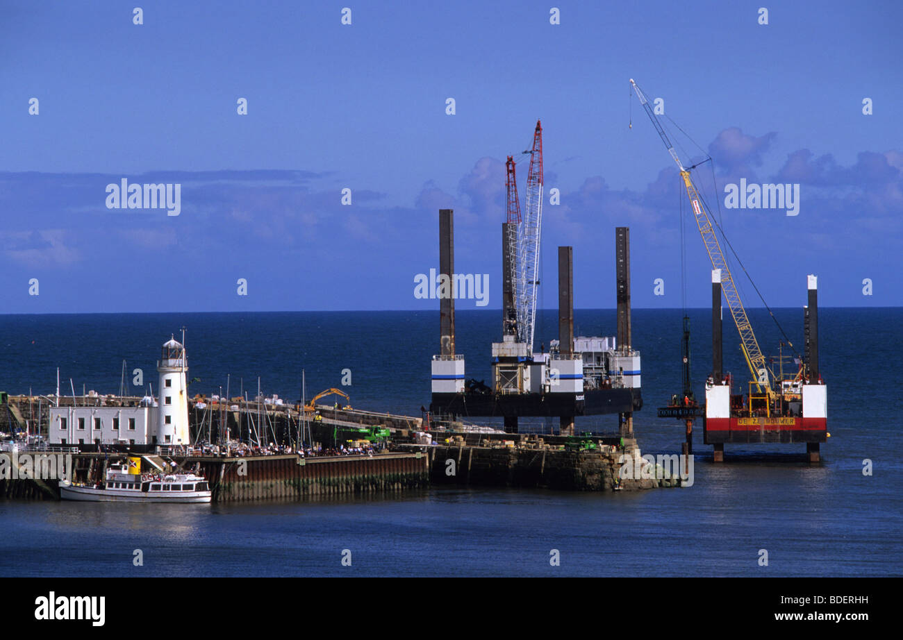 the pleasure ship coronea moored at Scarborough harbour by giant cranes ...