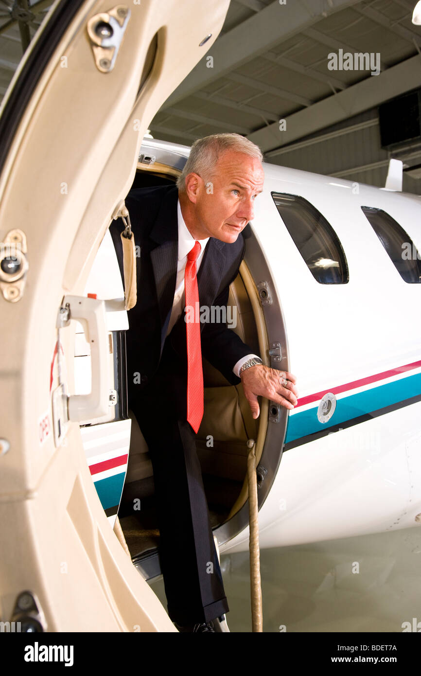 Middle-aged businessman leaving private jet plane Stock Photo - Alamy Middle-aged businessman leaving private jet plane Stock Photo - Alamy