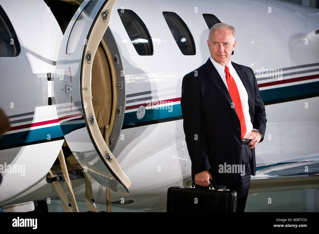 Middle-aged businessman leaving private jet plane Stock Photo - Alamy Middle-aged businessman leaving private jet plane Stock Photo - Alamy