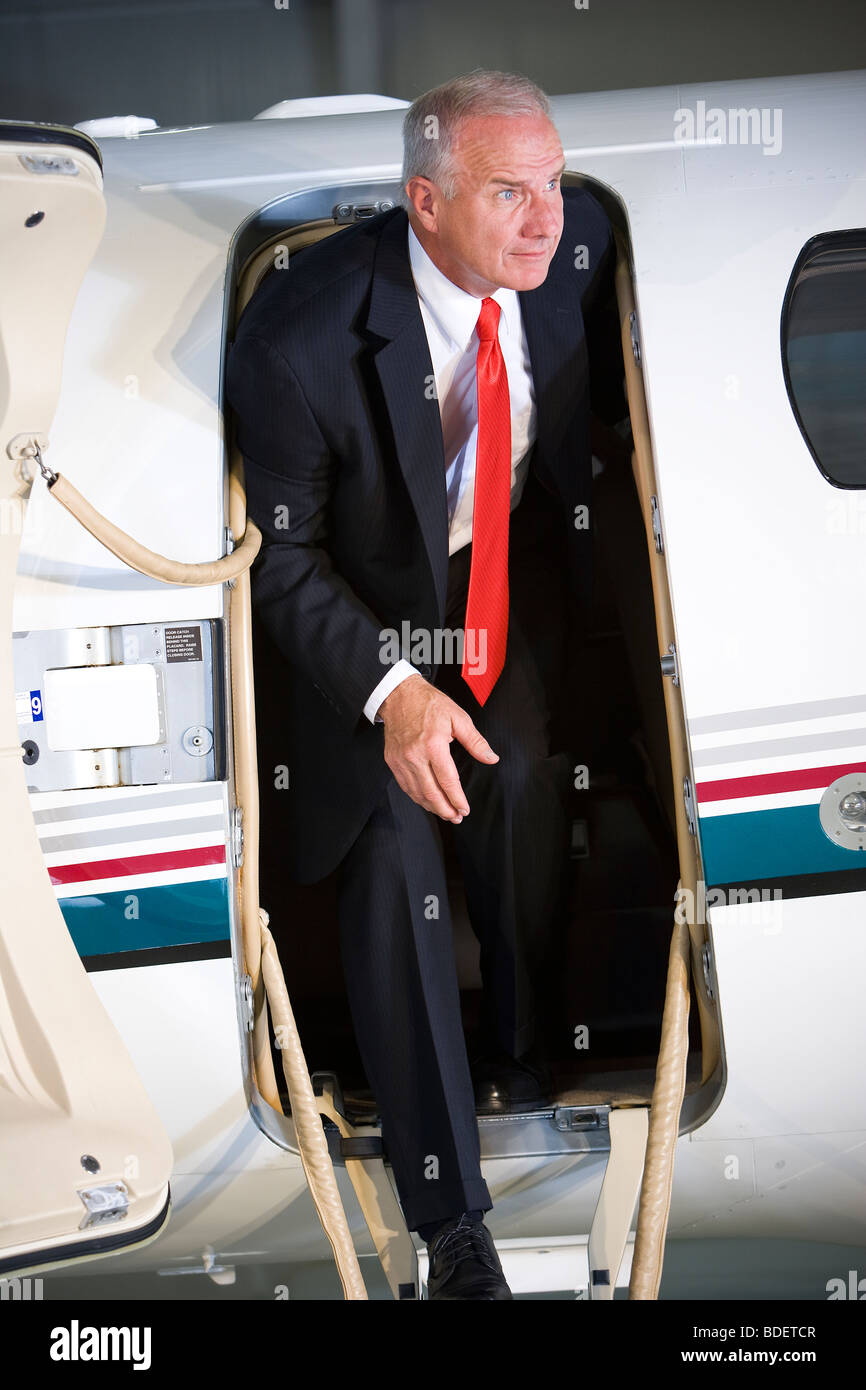 Business stepping off plane hi-res stock photography and images - Alamy