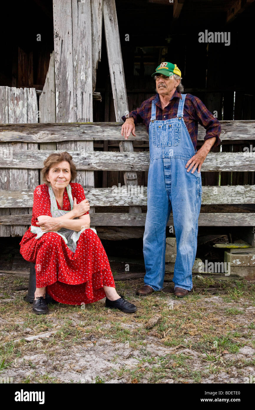 Senior couple on farm near barn Stock Photo - Alamy