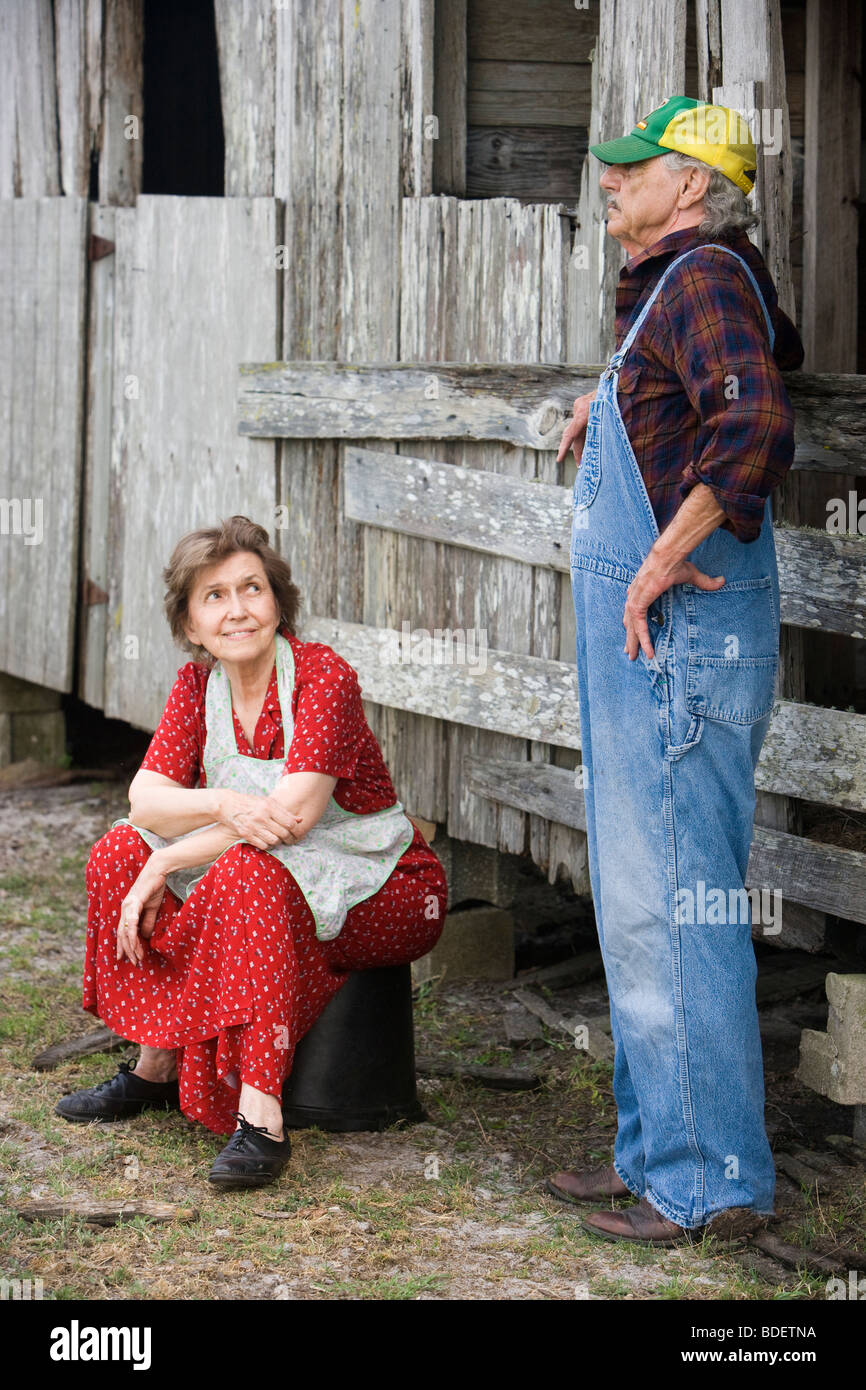 Senior couple on farm near barn Stock Photo - Alamy