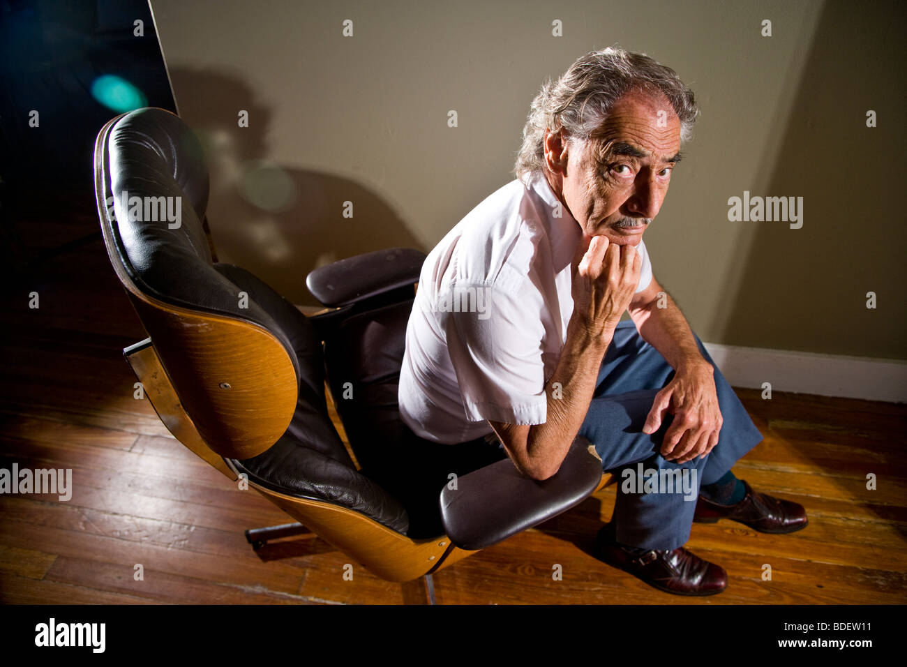 Man sitting on chair side angle hi-res stock photography and images - Alamy