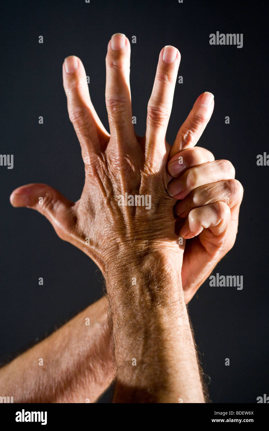 Elderly male arthritic hands hi-res stock photography and images - Alamy