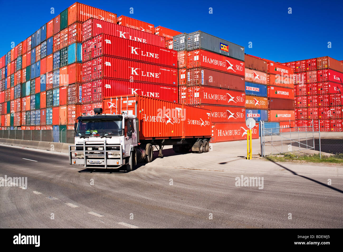 A semi-trailer truck hauls a container from a port container depot.The ...