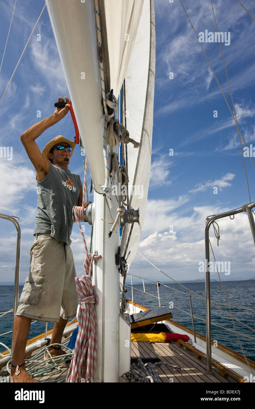 Man raising sails in the Gulf of Papagayo in Guanacaste, Costa Rica ...