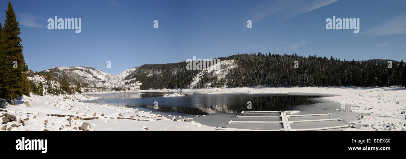 Snowy place of fun, families frolic and sledge near icy lake in soft ...