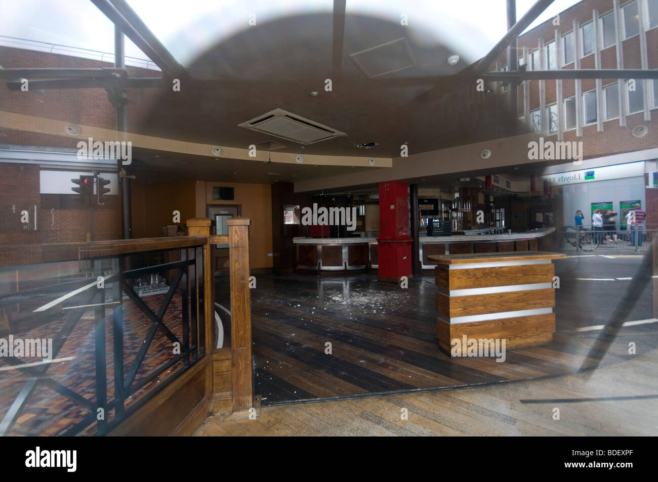 Margate High street empty shops reflection of Lloyds Bank in window of ...