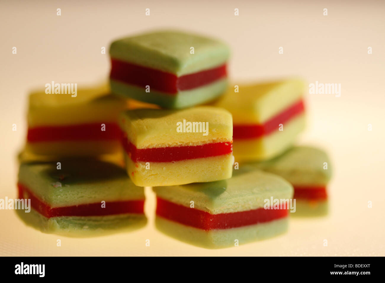 Pile of fruity allsorts sweets on white background Stock Photo - Alamy
