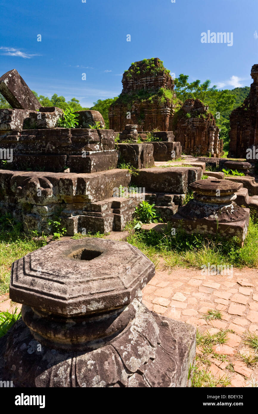 The carved base of a stone pillar lies inthe open at the ancient site ...