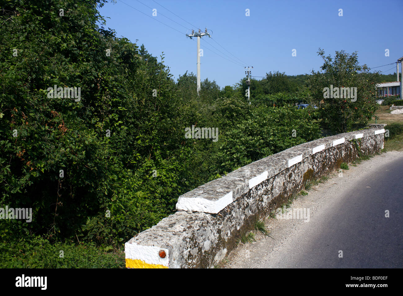 Electric line over the road Stock Photo - Alamy