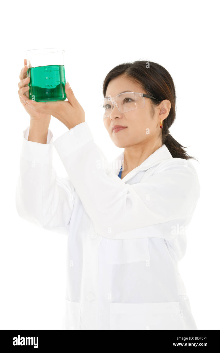 Beautiful Asian laboratory technician studying a beaker of liquid Stock ...