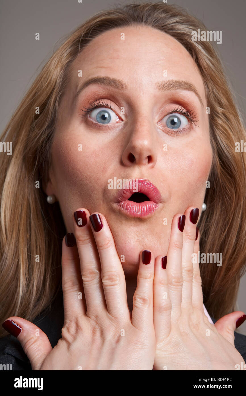 Shocked startled woman face hi-res stock photography and images - Alamy