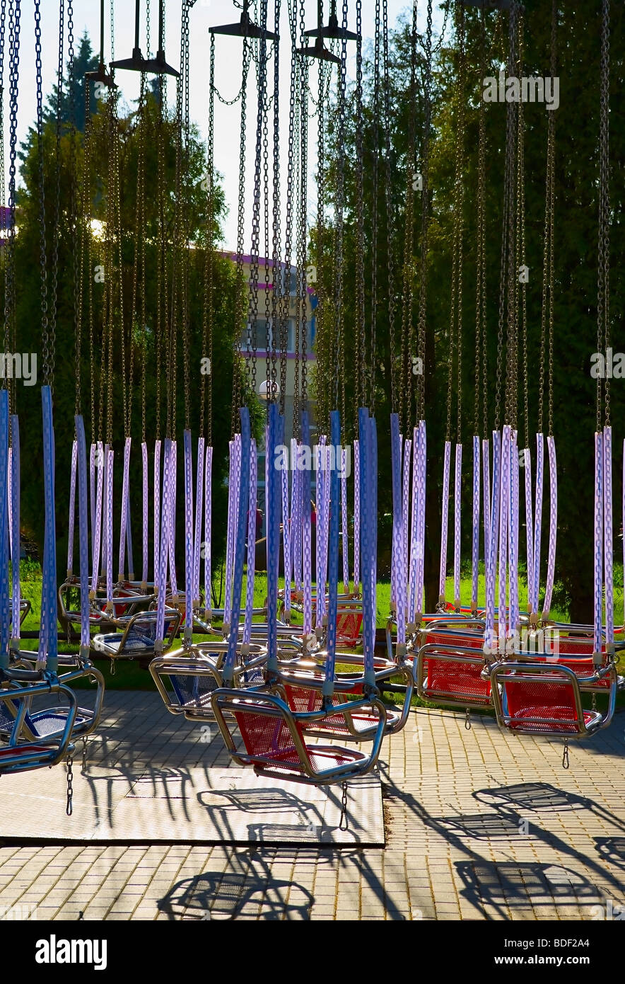 Color chain swings in amusement park. Summer Stock Photo - Alamy