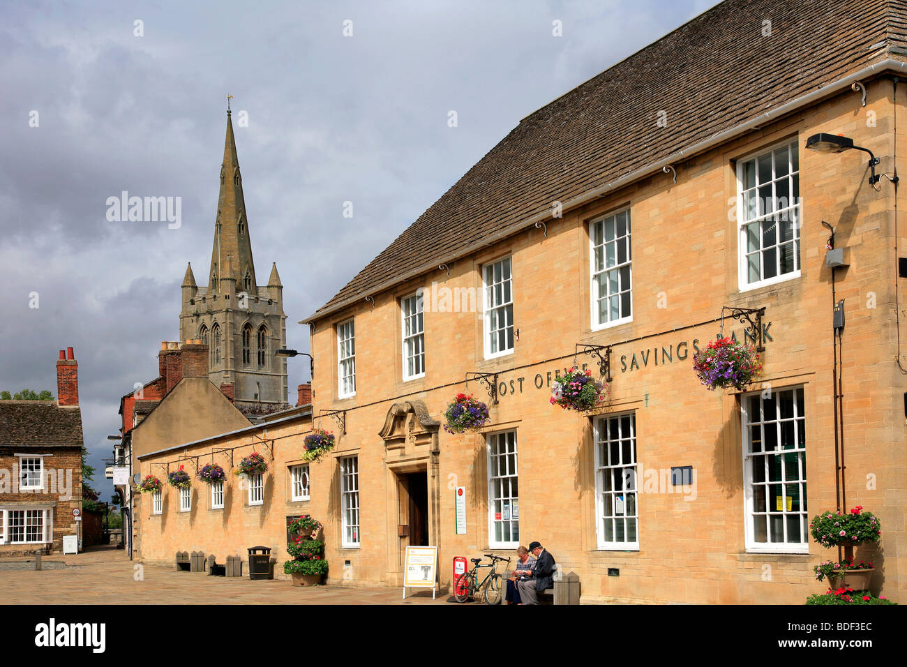 Oakham Post Office and All Saints church Oakham Town Rutland County ...