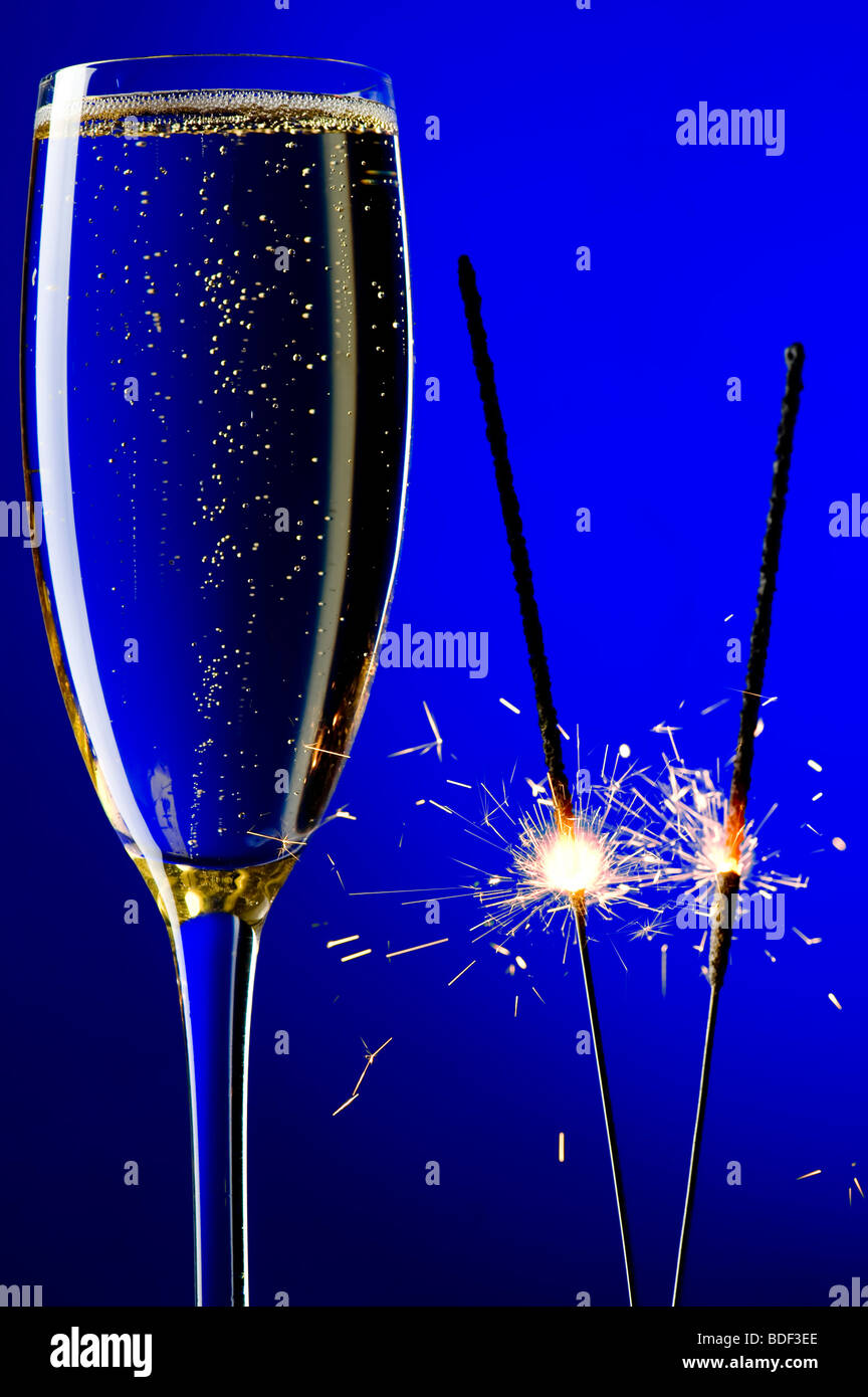 object on blue - champagne glasses and sparkles closeup Stock Photo - Alamy