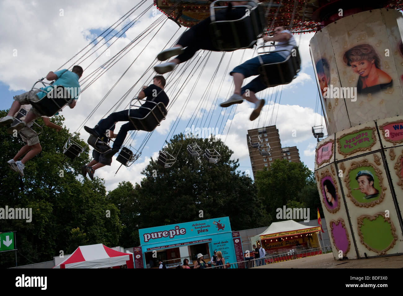band concert crowd fun fair lake district swings tents young Stock ...
