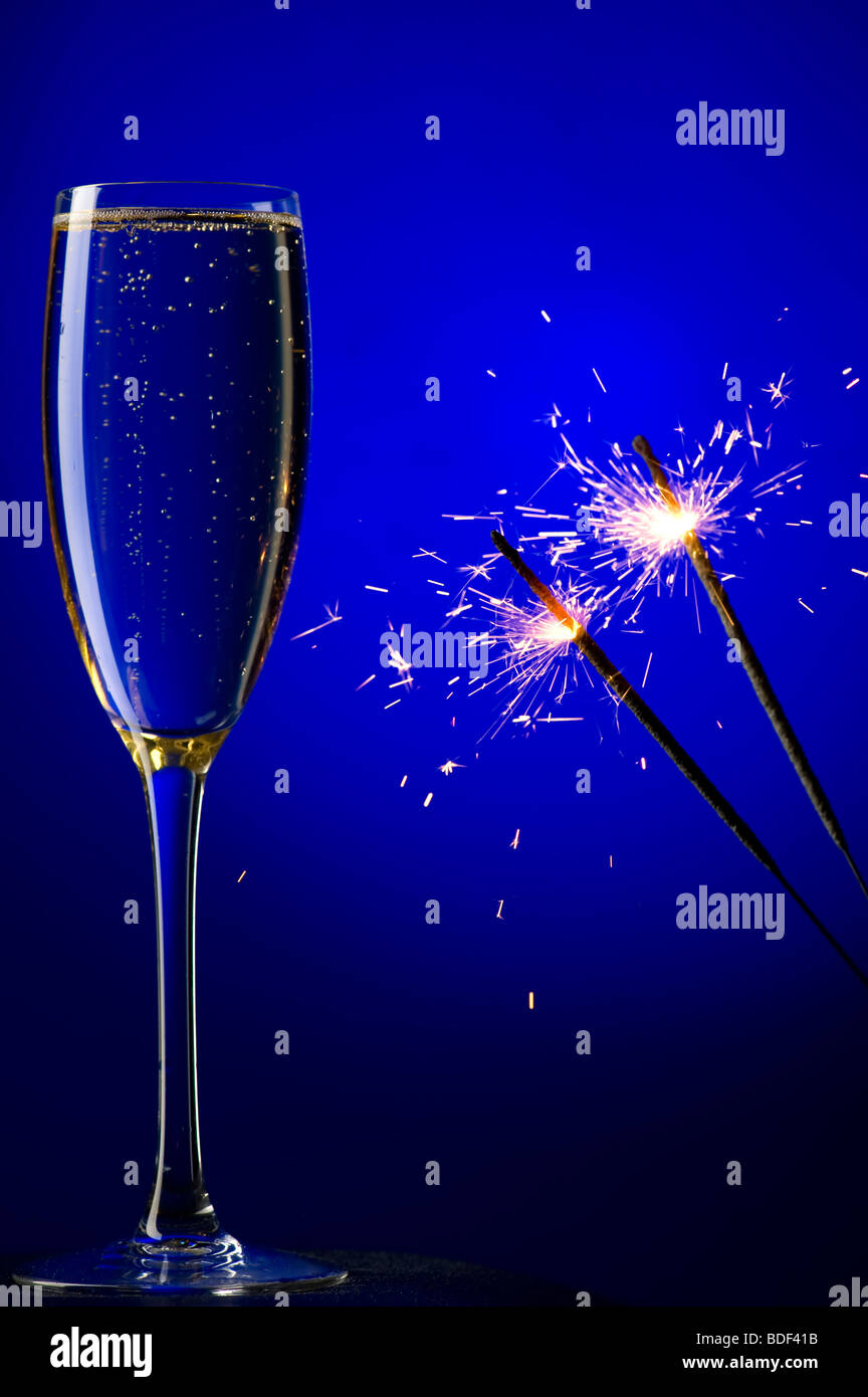 object on blue - champagne glasses and sparkles closeup Stock Photo - Alamy