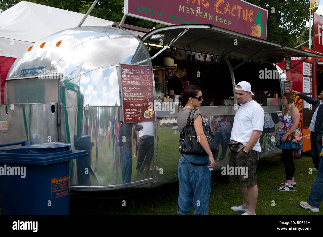 band concert crowd fun fair lake district swings tents young Stock ...