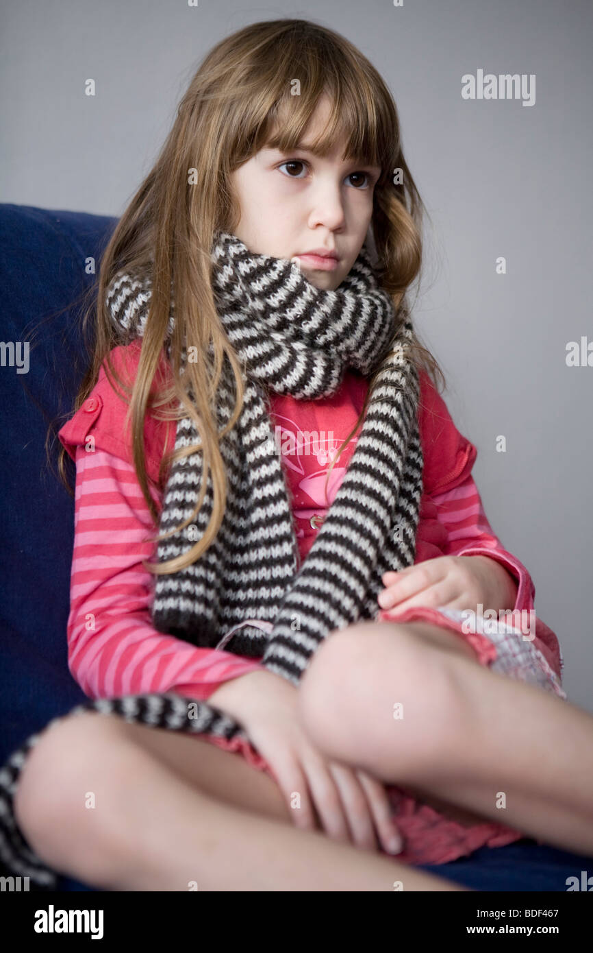 Llittle cute sick girl with scarf. Sore throat Stock Photo - Alamy
