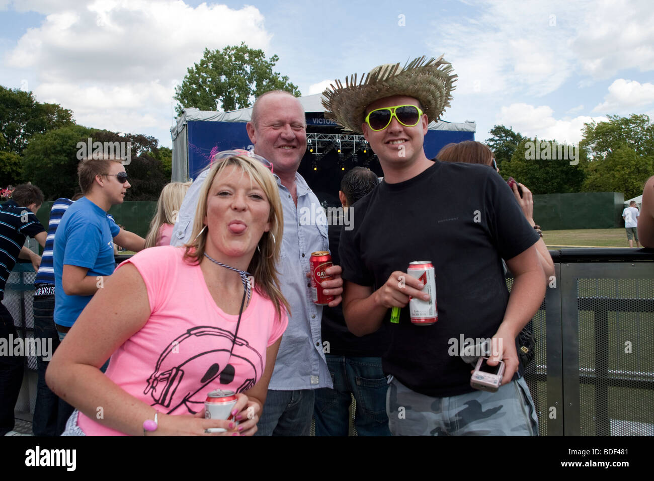 band concert crowd fun fair lake district swings tents young Stock ...
