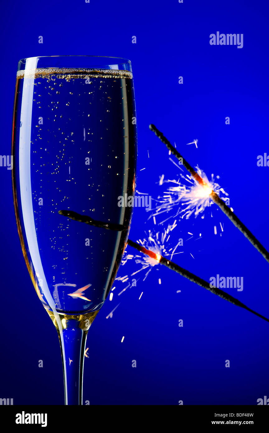 object on blue - champagne glasses and sparkles closeup Stock Photo - Alamy