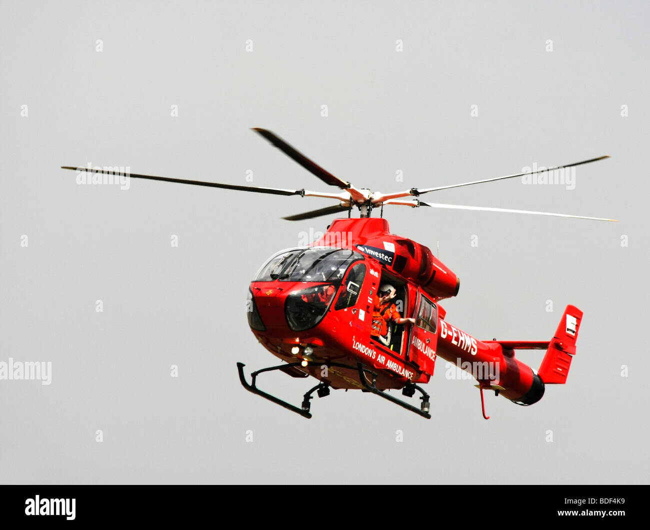 Red London Air Ambulance Emergency Rescue Helicopter in flight with a ...