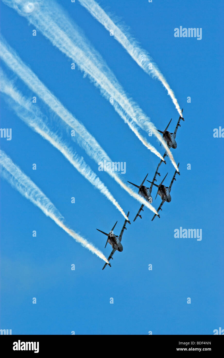 A formation of four BAE Hawk jets passing at a low altitude Stock Photo ...