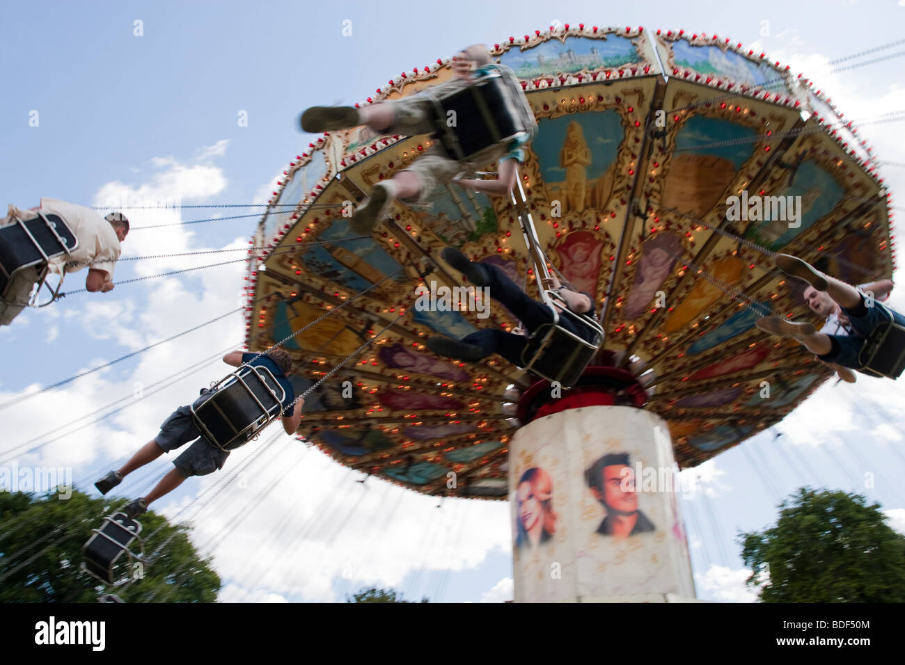 band concert crowd fun fair lake district swings tents young Stock ...