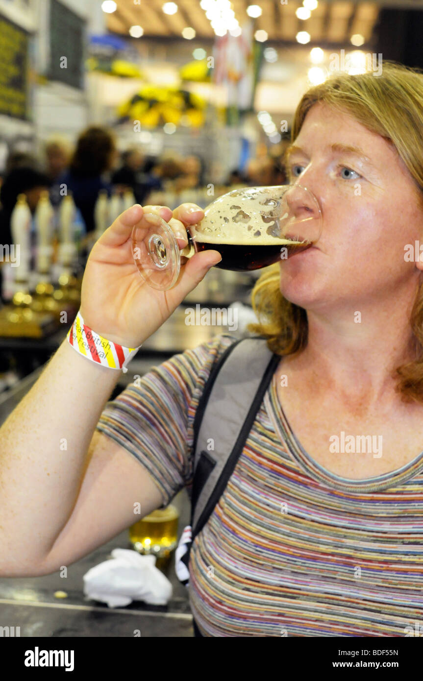 Female Camra member drinks the Champion Beer "Ruby Mild' at the 2009 ...