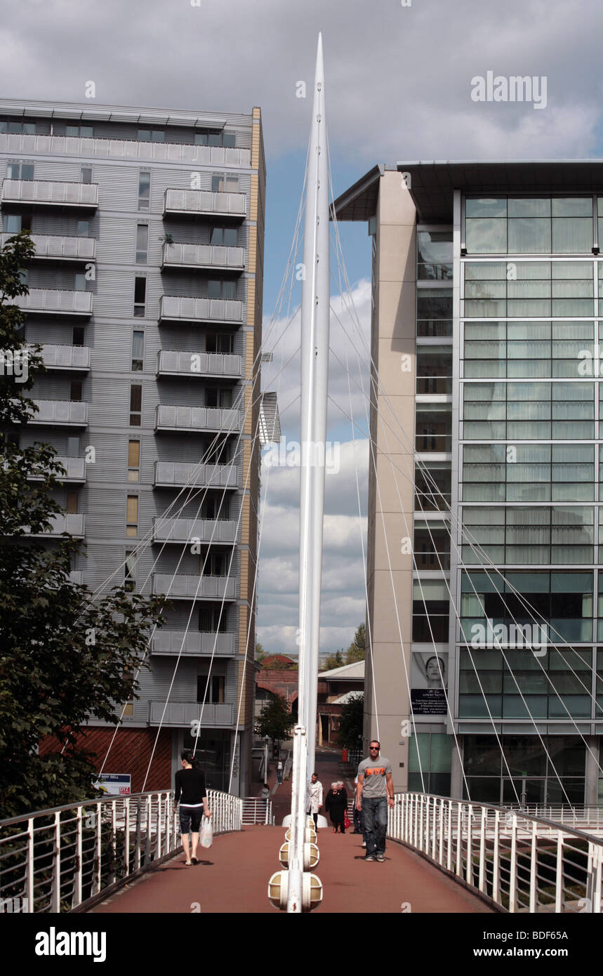 Footbridge spanning The River Irwell with The Lowry Hotel in the ...