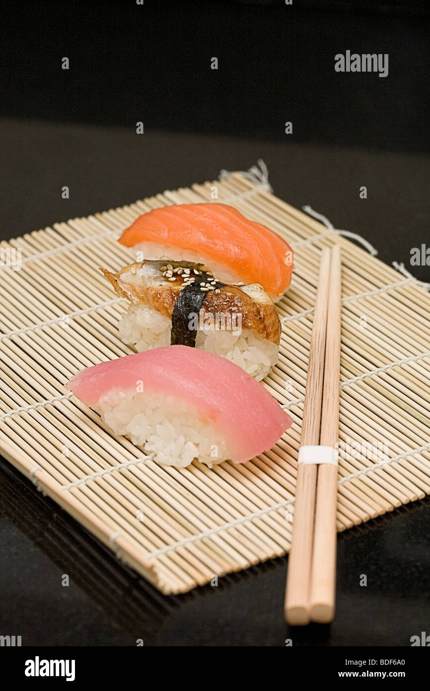 Three pieces of salmon sushi hi-res stock photography and images - Alamy