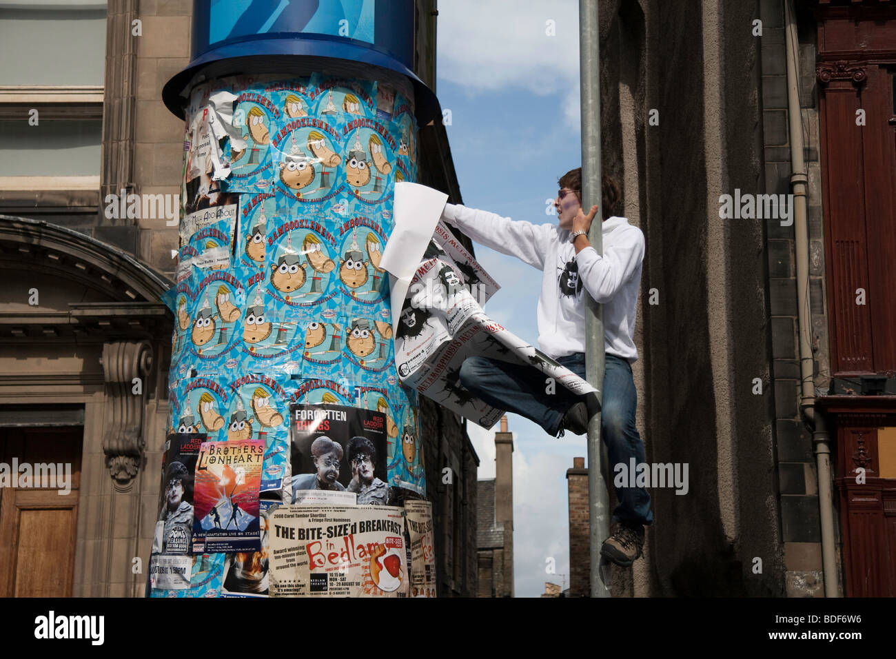 Attaching advertising poster hi-res stock photography and images - Alamy