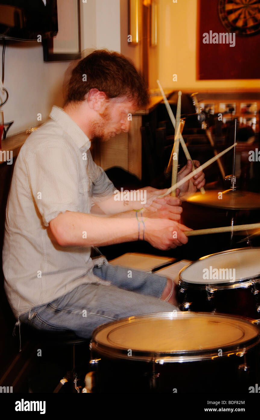 A drummer playing in Harry's pub in Aberystwyth Stock Photo - Alamy