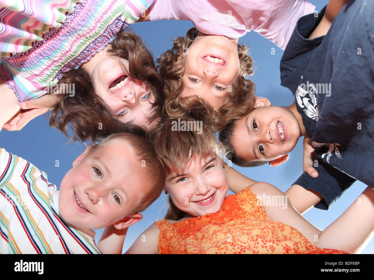 Group of Five Friends Outdoors Looking Down Smiling Stock Photo - Alamy