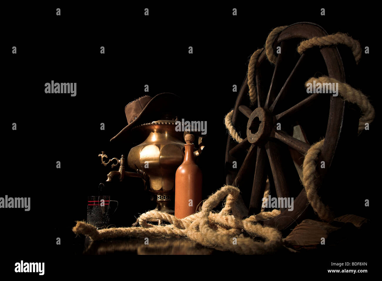 village still life with wood wheel and rope Stock Photo - Alamy