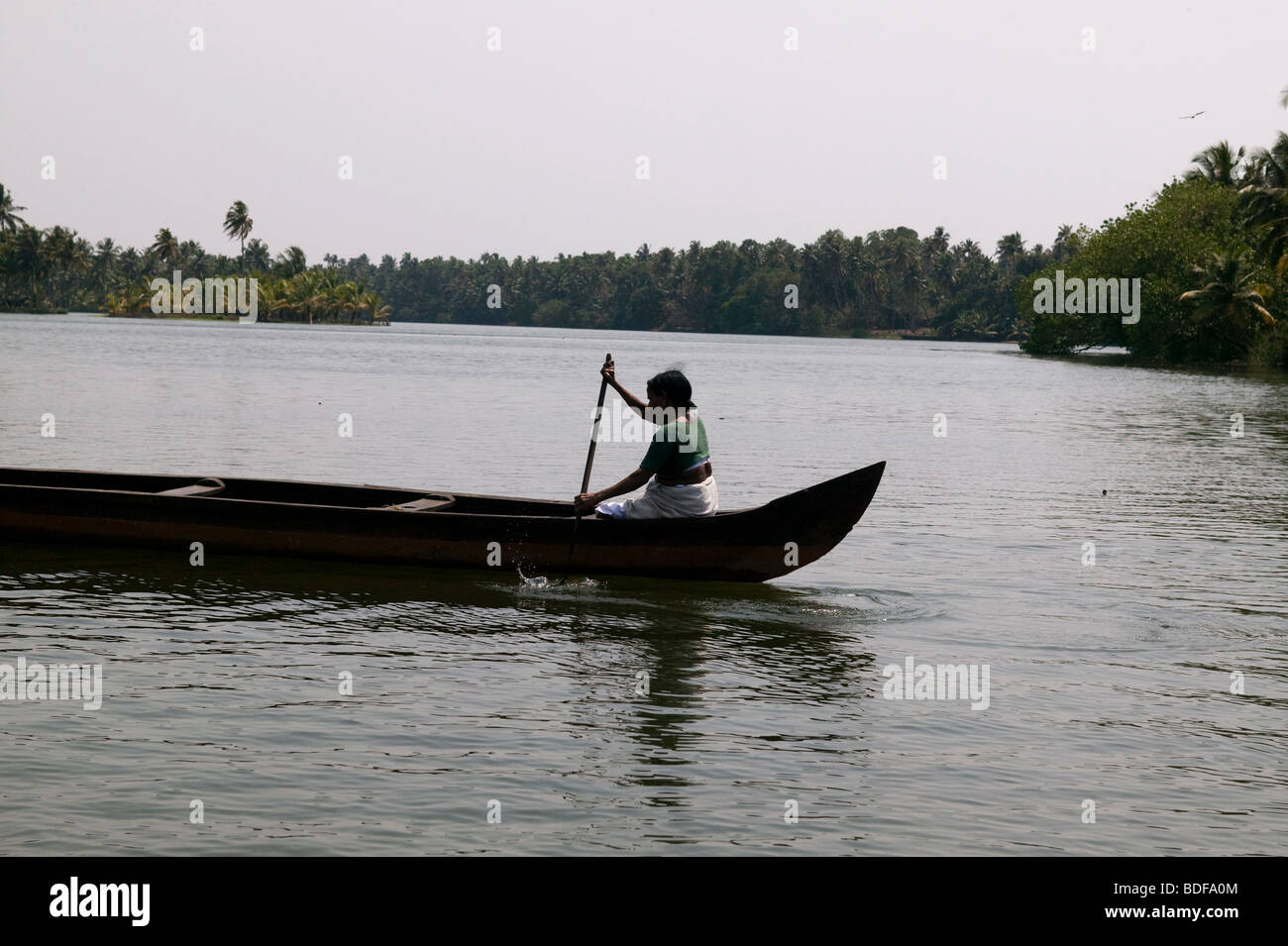 Woman rowing in boat in India Stock Photo - Alamy
