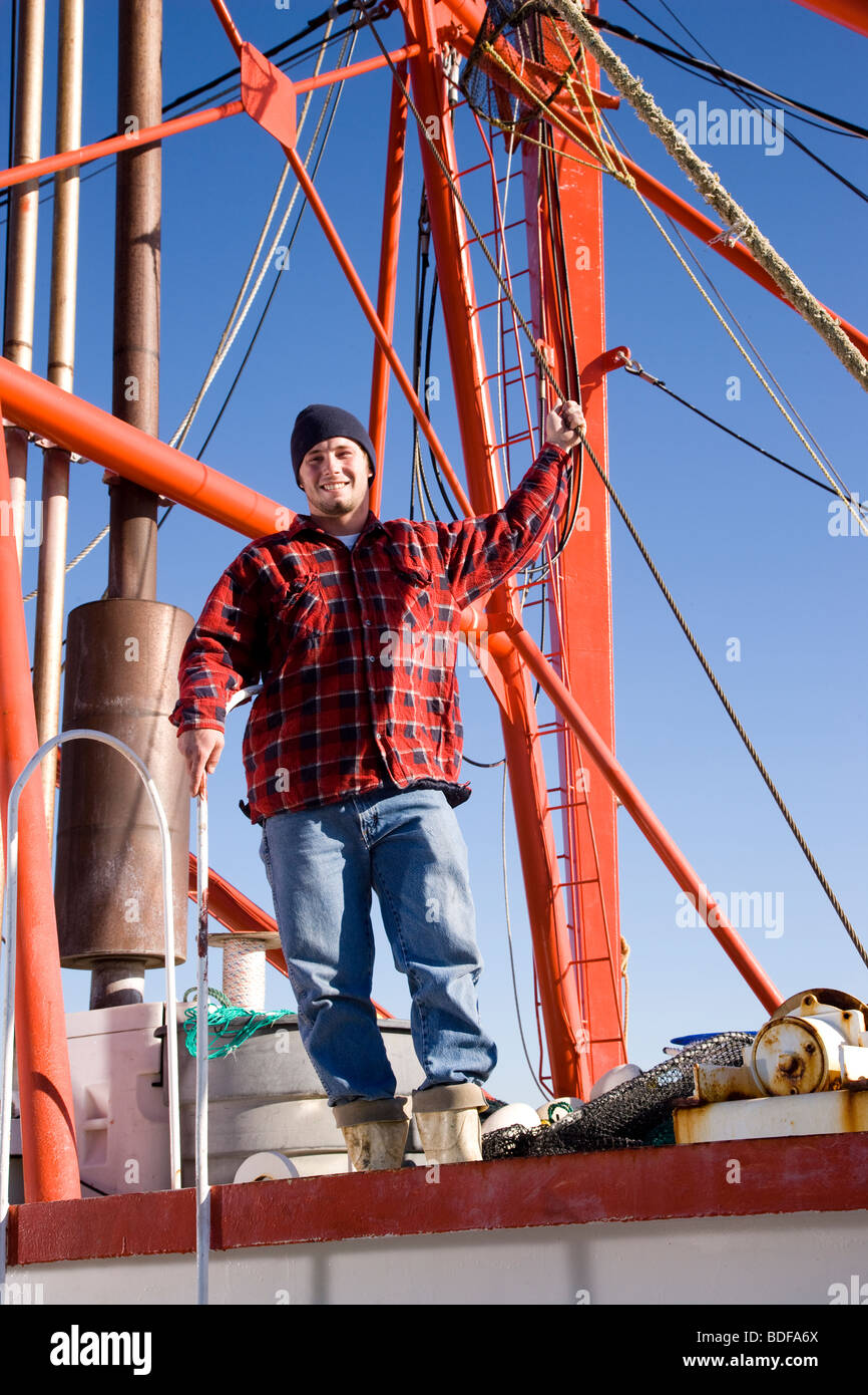 Man in blue shirt on pier hi-res stock photography and images - Alamy