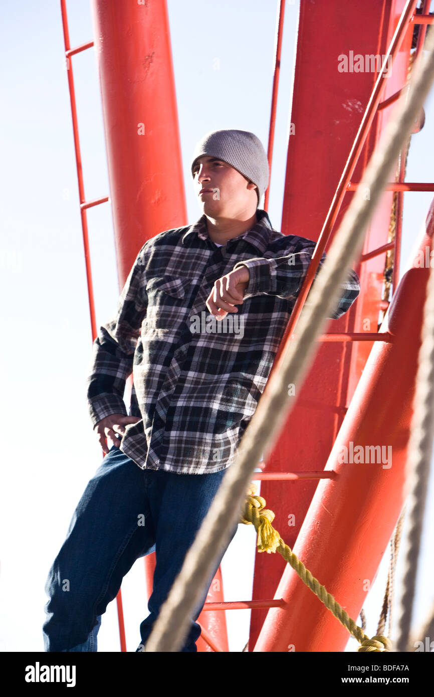 Young fisherman in plaid shirt standing on fishing boat Stock Photo - Alamy