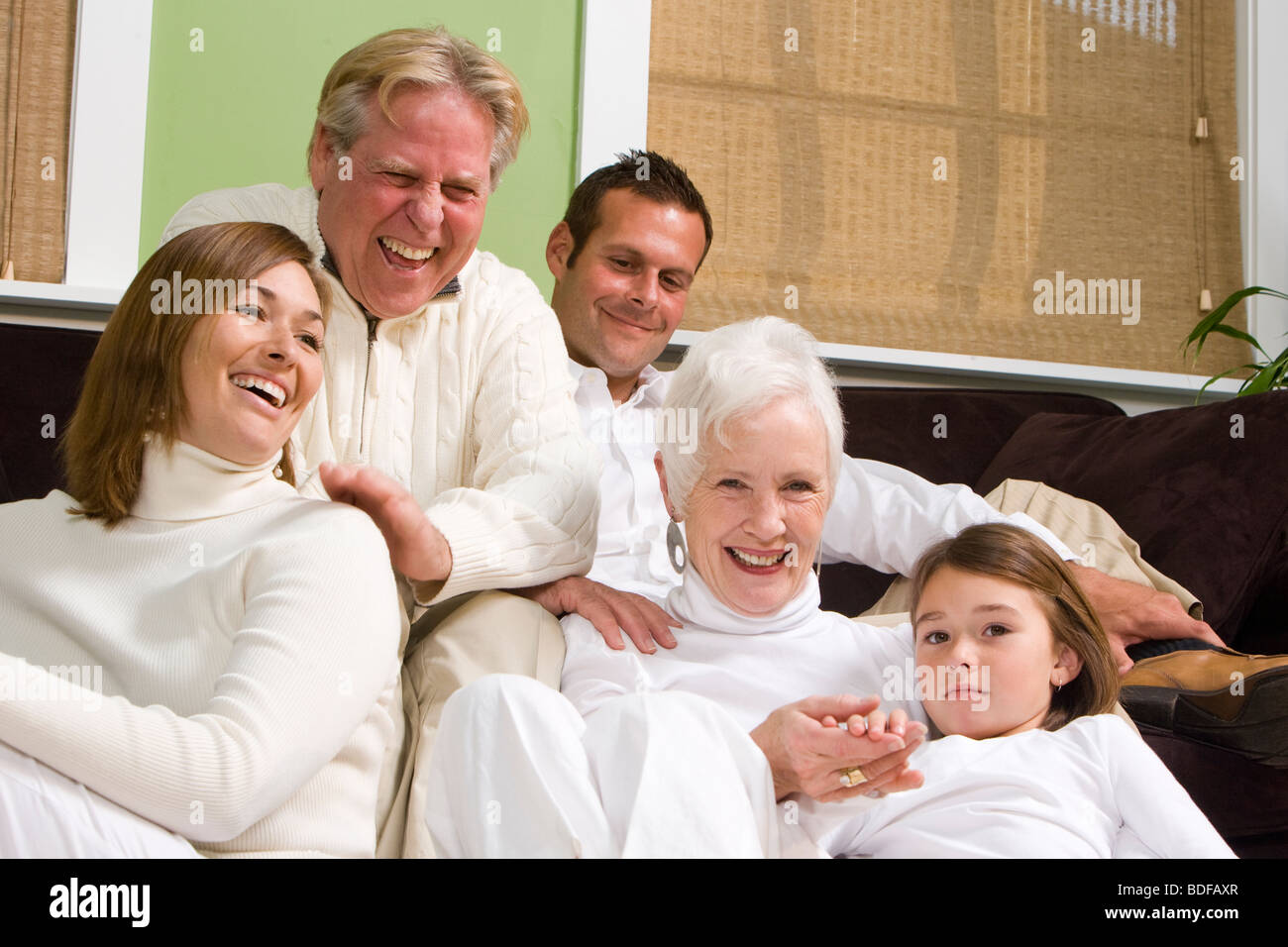 Happy multi-generational family posing in living room Stock Photo - Alamy