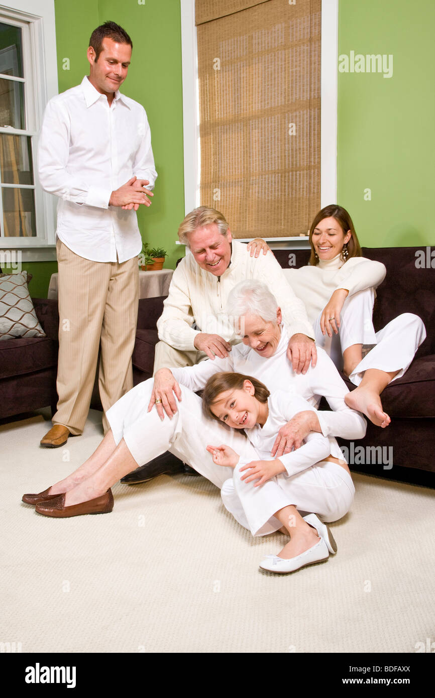 Happy multi-generational family relaxing in living room Stock Photo - Alamy