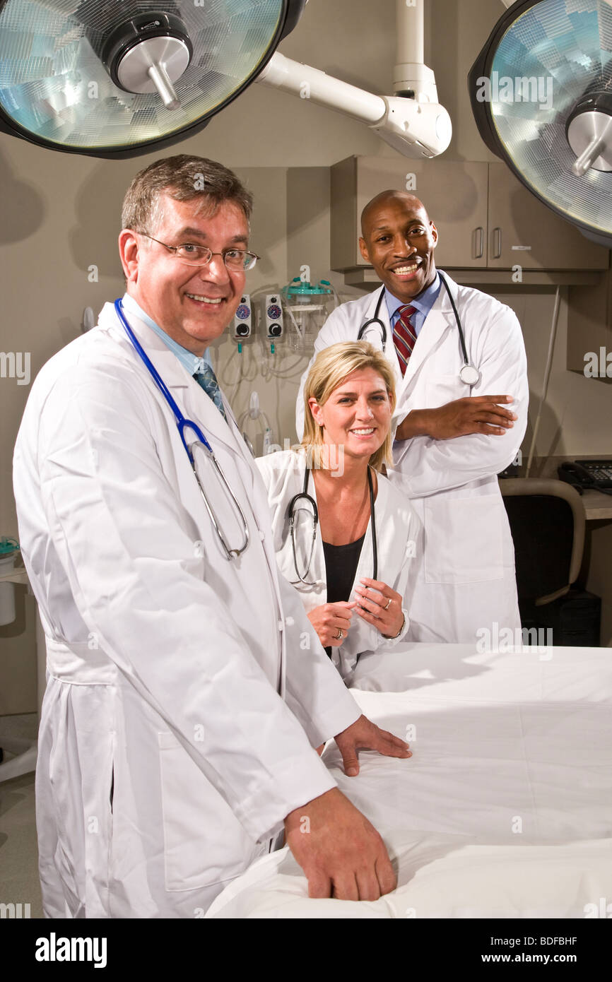 Portrait of doctors in hospital room with surgical lights Stock Photo ...