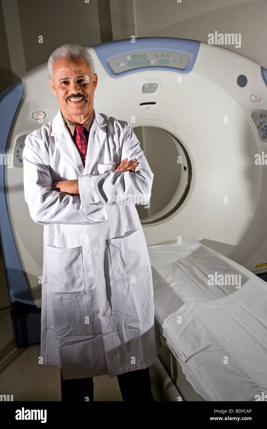 African American radiologist next to CT scanner Stock Photo - Alamy