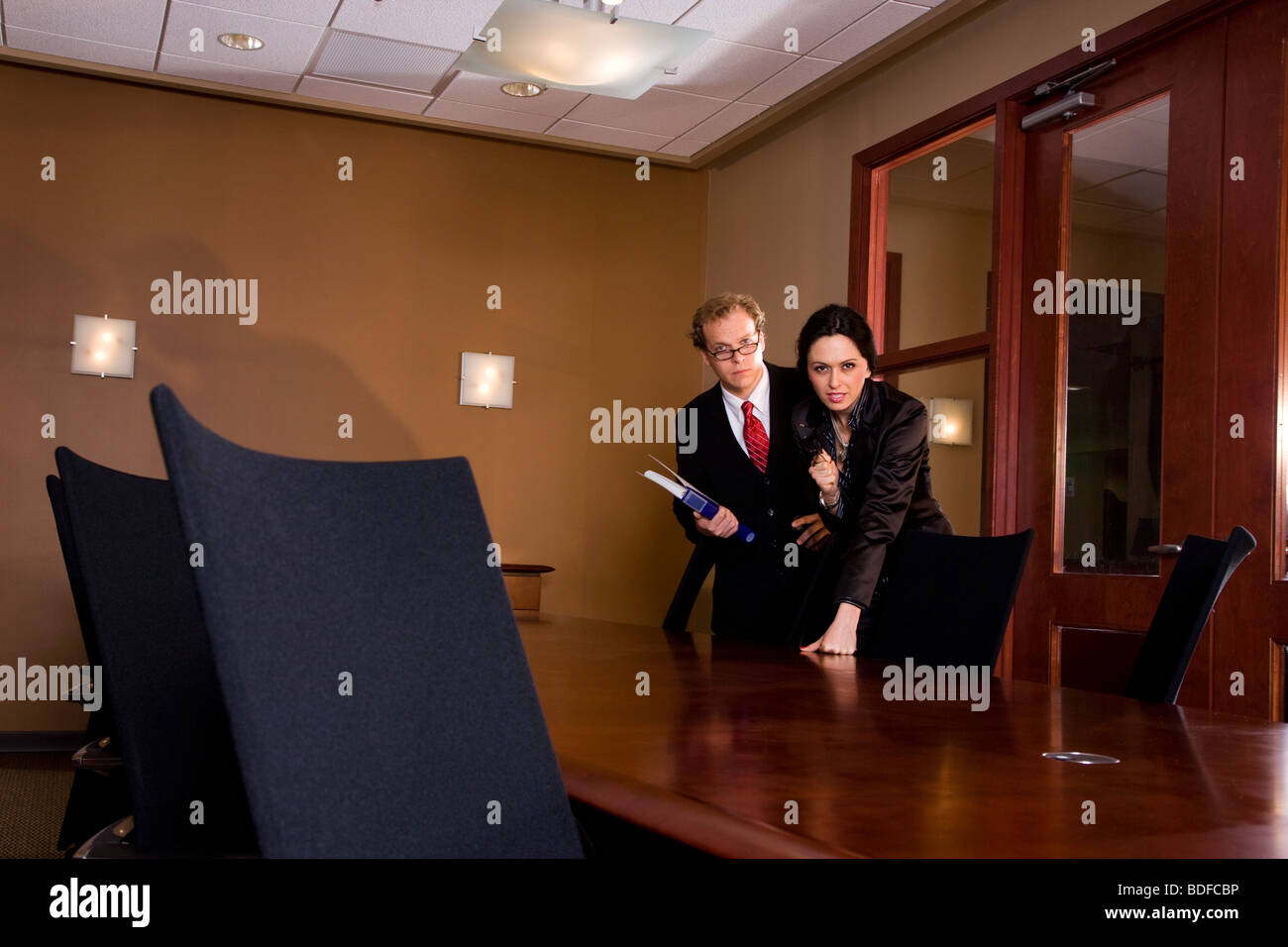 Serious business people in office boardroom Stock Photo - Alamy