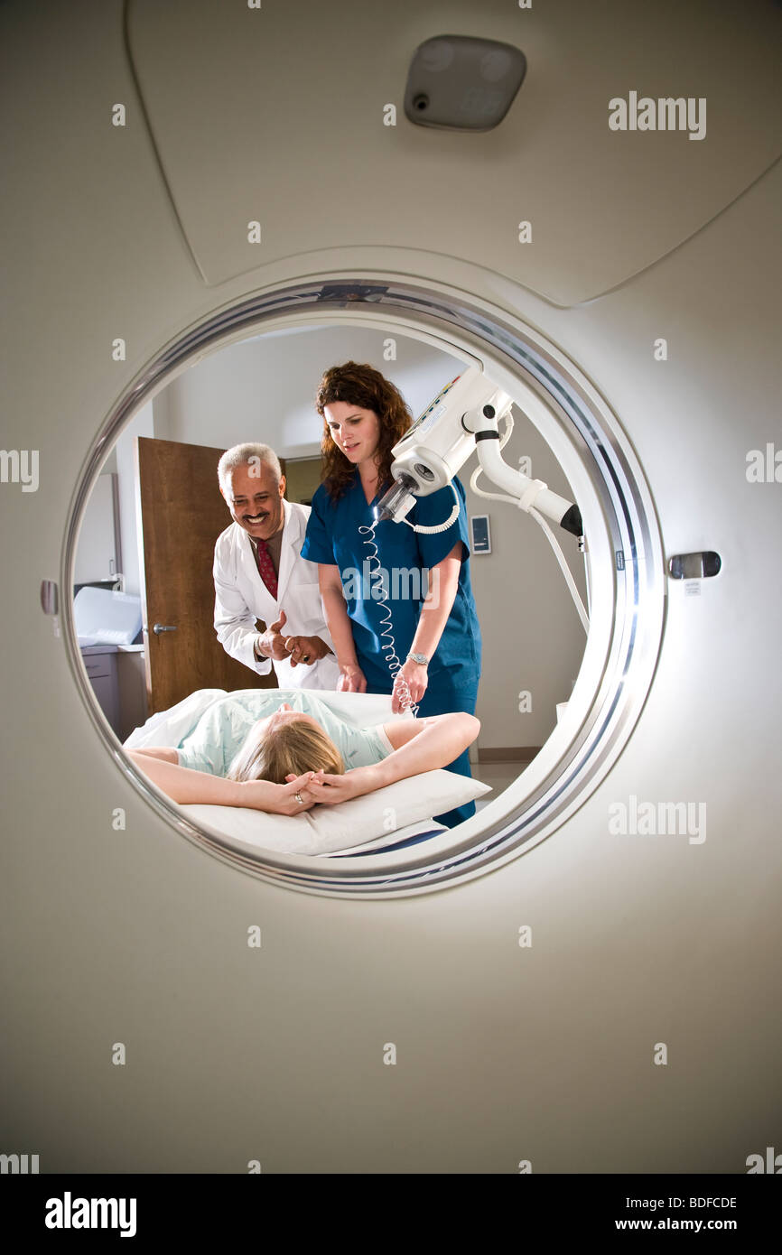 Healthcare workers preparing patient for CAT scan Stock Photo - Alamy