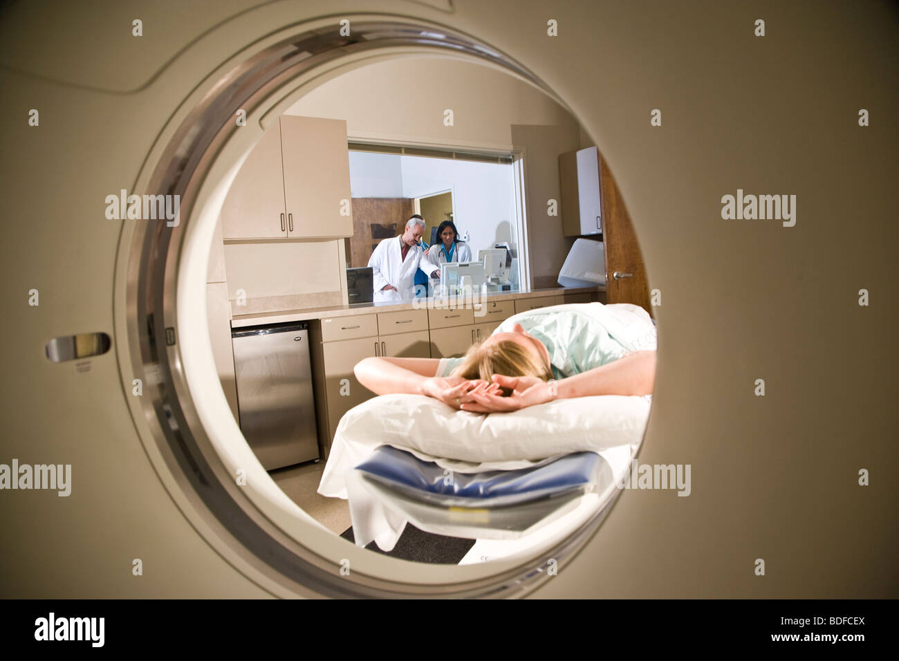 Patient lying on cat scan hi-res stock photography and images - Alamy