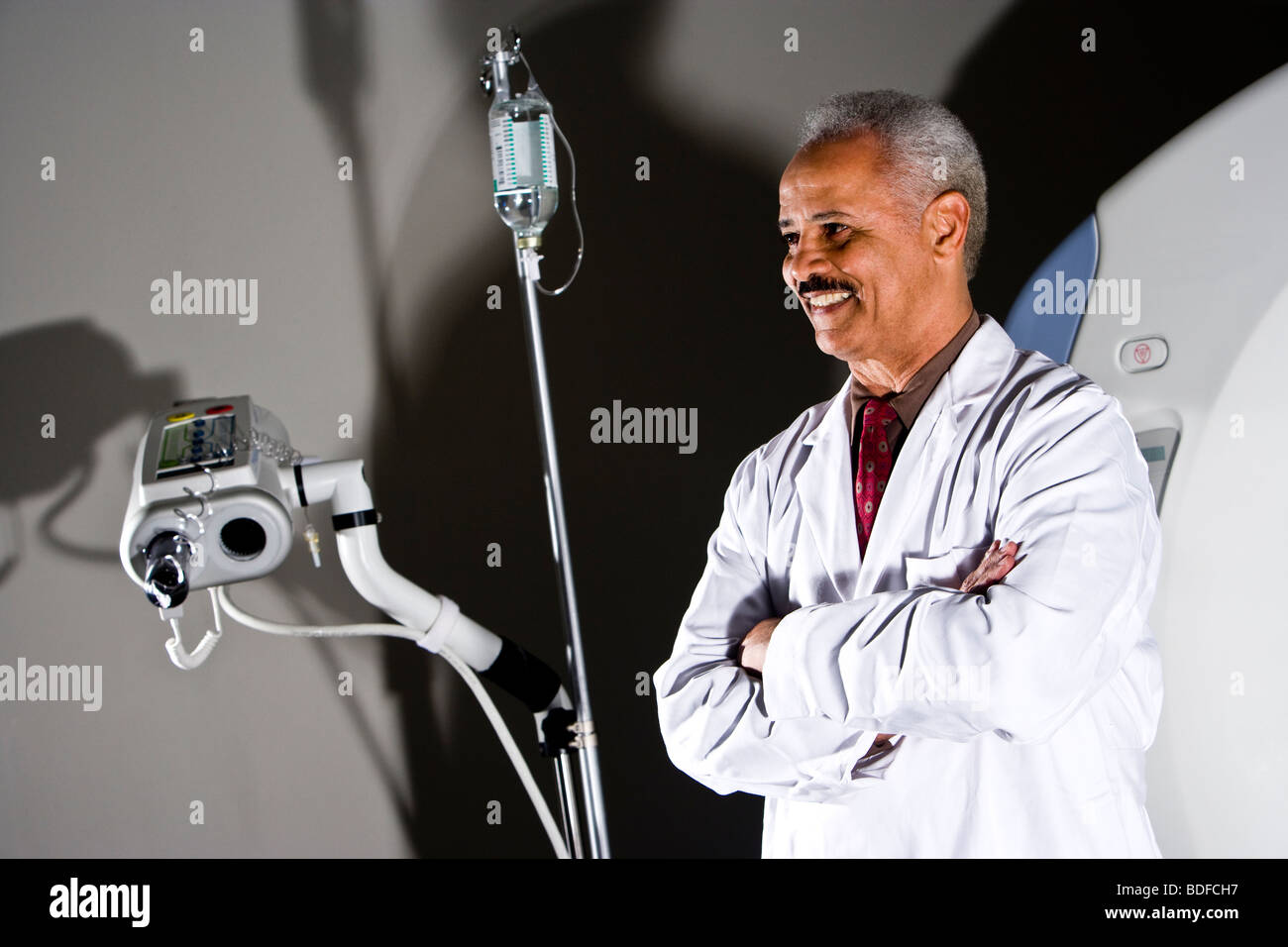 African American radiologist next to CAT scan machine Stock Photo - Alamy