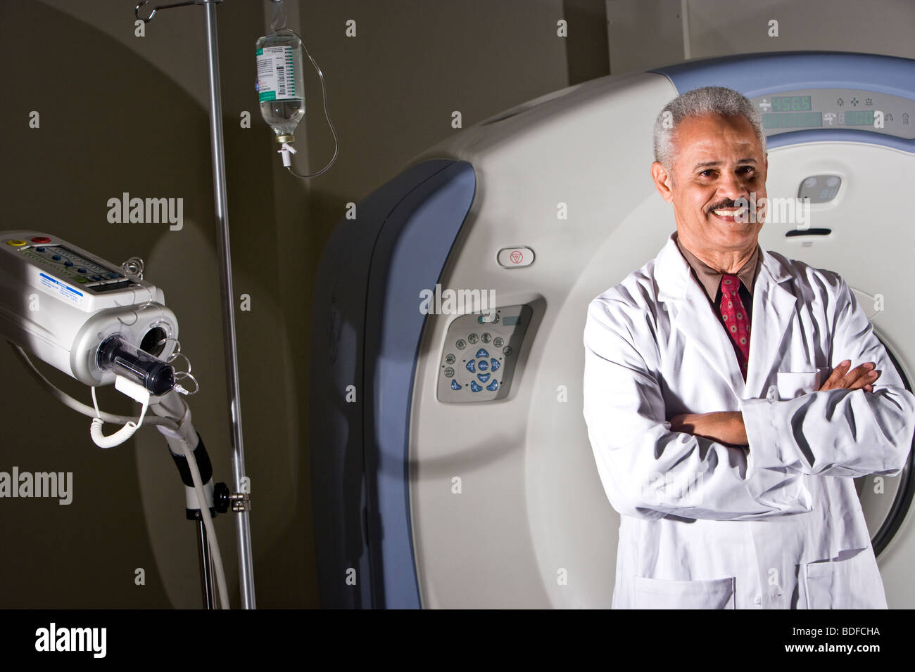 African American radiologist next to CAT scan machine Stock Photo - Alamy